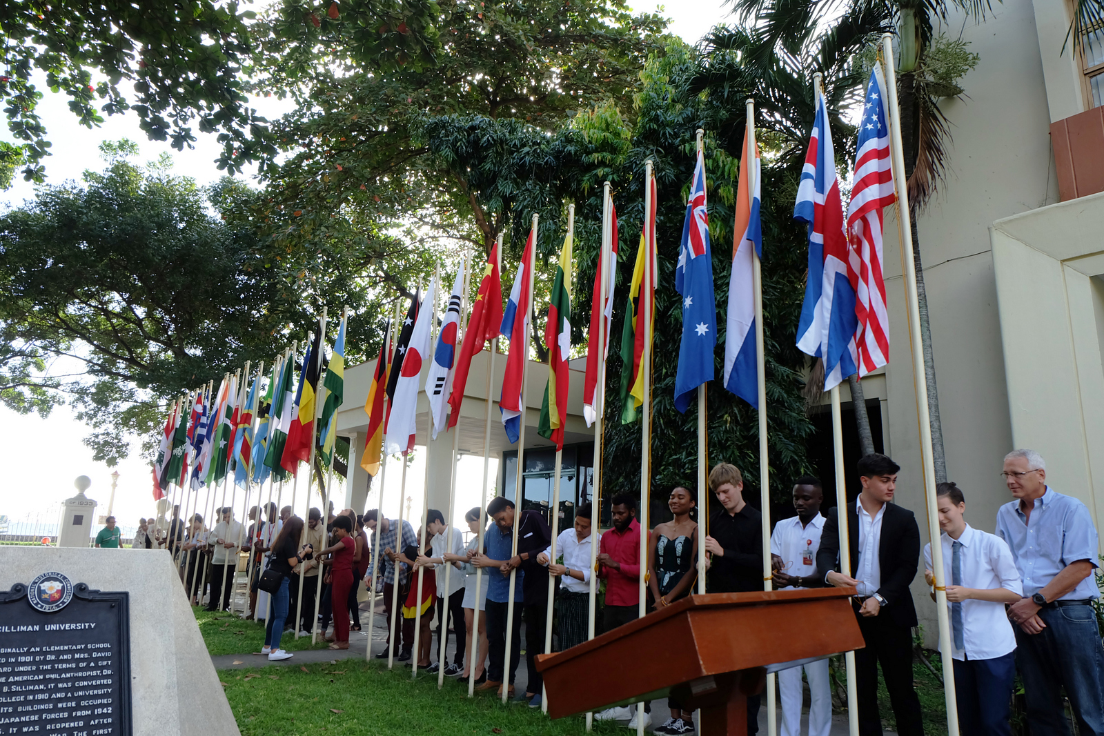 59 national flags raised to open International Cultural Exchange Month ...